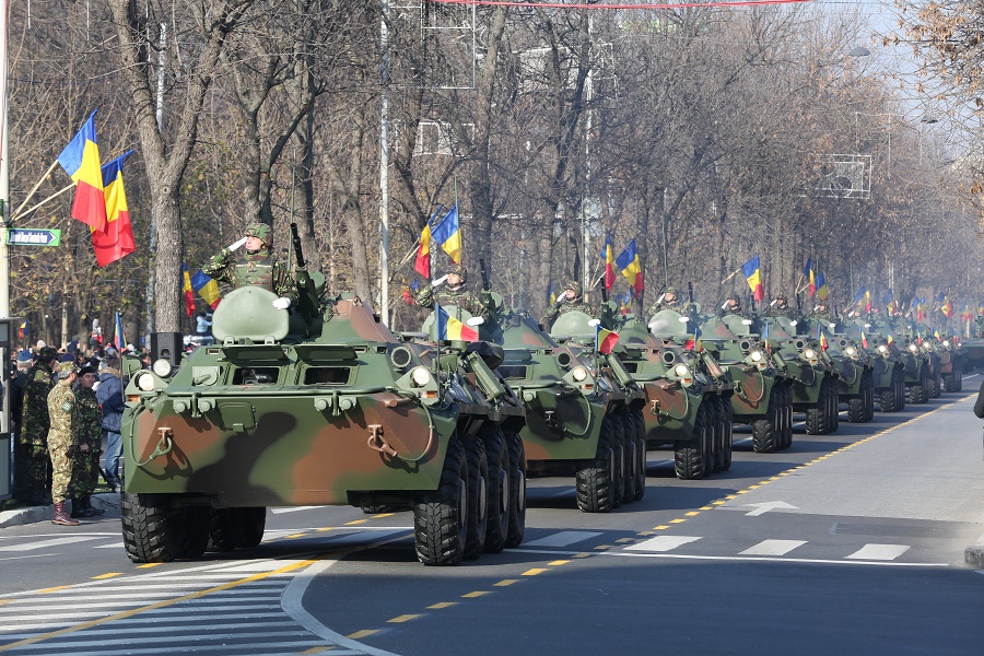 Thousands of people enjoy the sunny weather and the military parade on ...